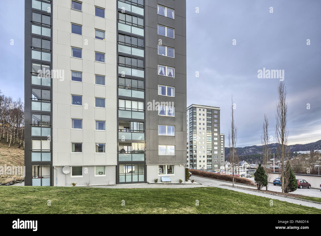 Residential low-rise flats in Sandnes. There are cars outside, and ...