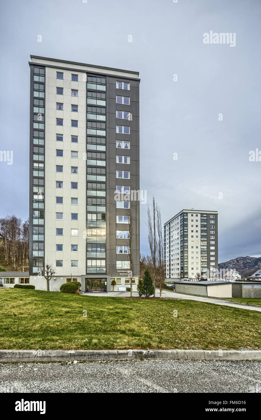 Residential low-rise flats in Sandnes. There are cars outside, and ...