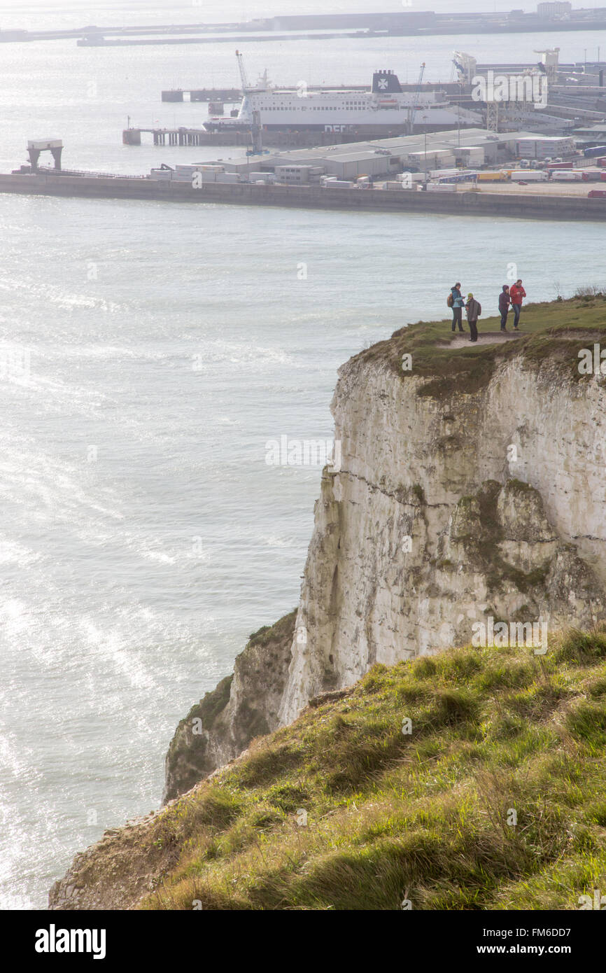 Port of Dover and white cliffs with tourists standing too close to the ...