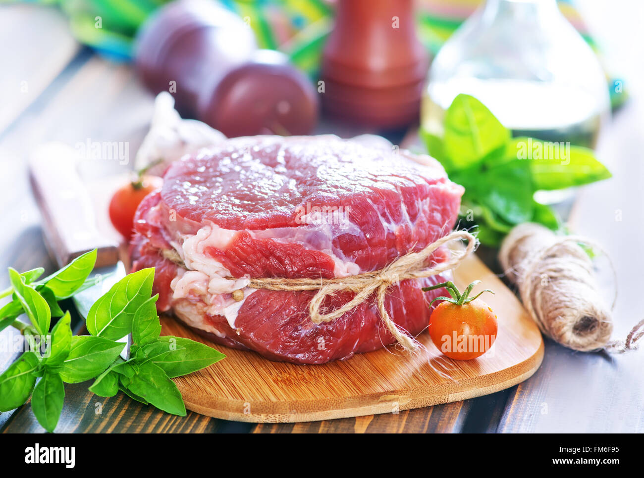 raw meat with spice and herb on a table Stock Photo - Alamy