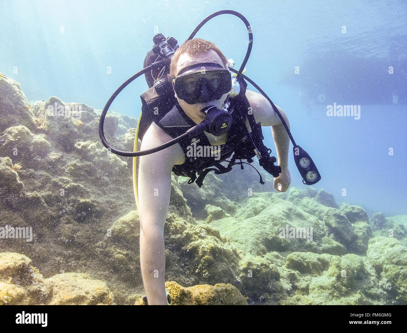 A man scuba diving on the sea floor Stock Photo - Alamy