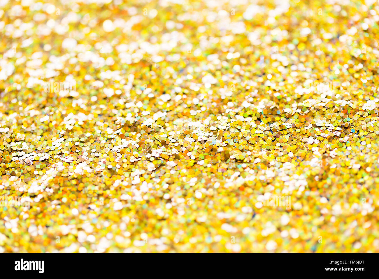 golden glitter or yellow sequins background Stock Photo - Alamy
