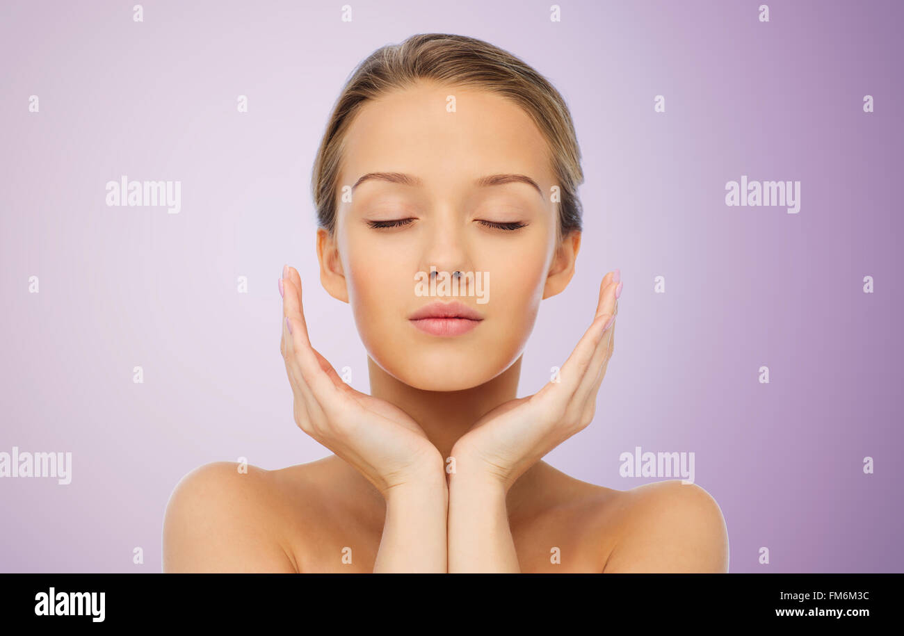young woman face and hands Stock Photo - Alamy