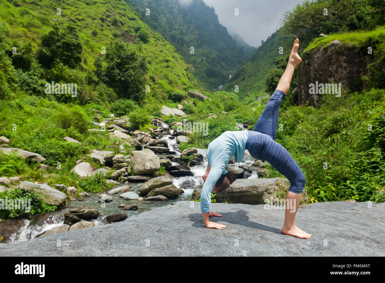 Woman doing urdhva dhanurasana hi-res stock photography and images - Alamy