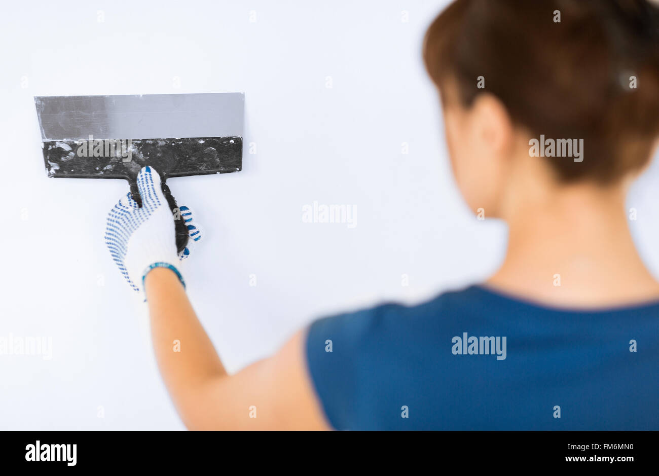 woman plastering the wall with trowel Stock Photo - Alamy