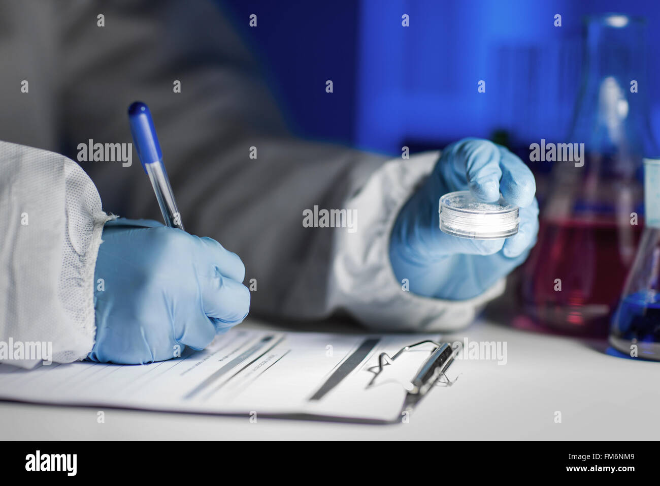 Writing research papers lab woman hi-res stock photography and images ...