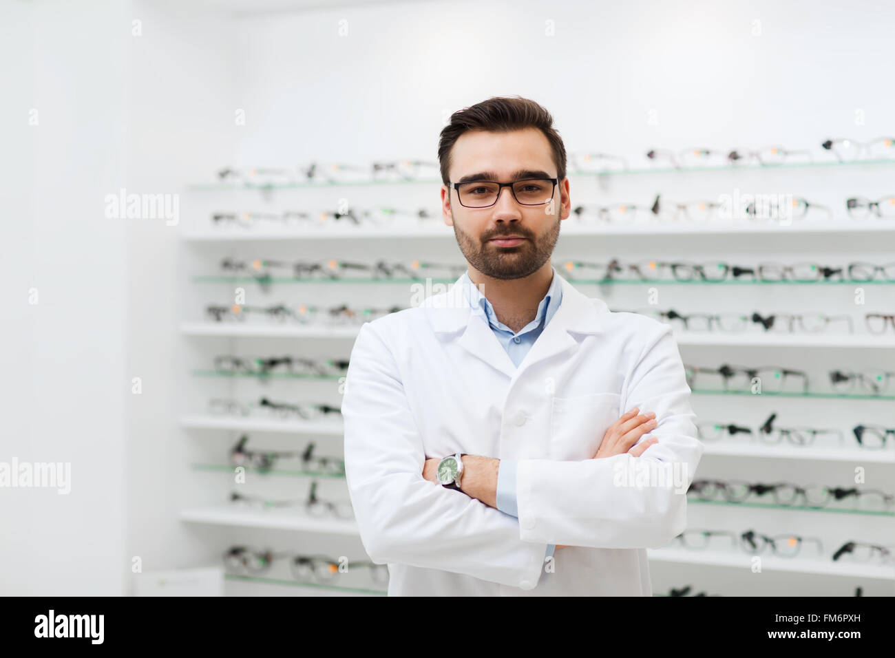 man optician in glasses and coat at optics store Stock Photo - Alamy