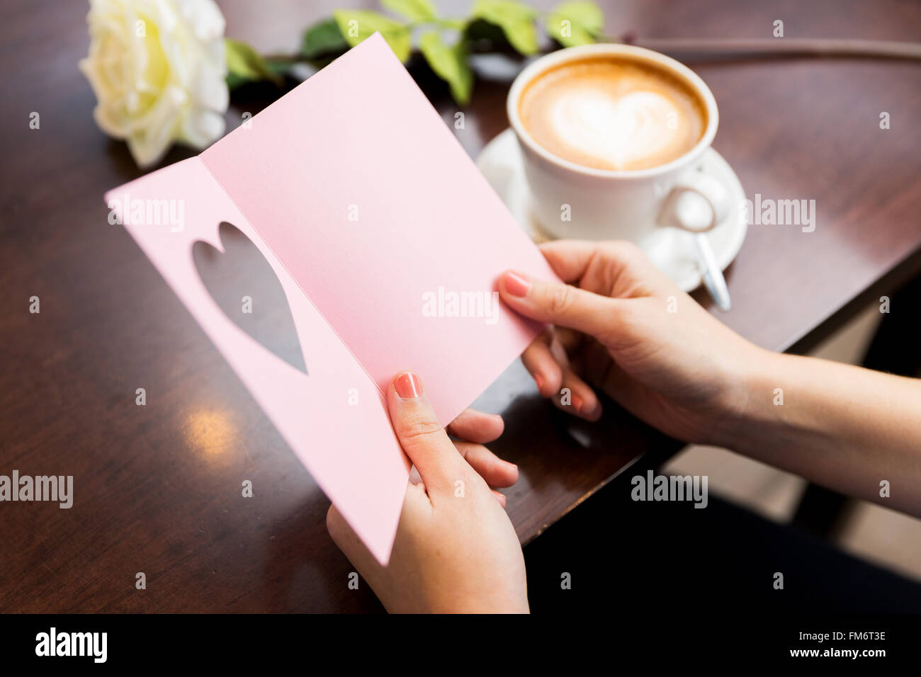 close up of woman reading greeting card and coffee Stock Photo - Alamy