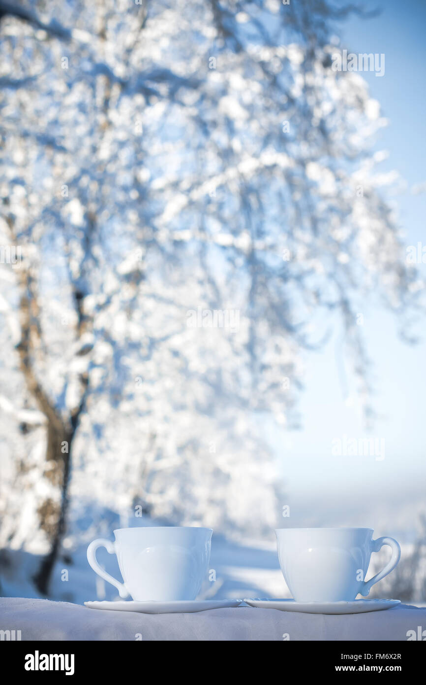 Two cups of tea on winter background Stock Photo - Alamy