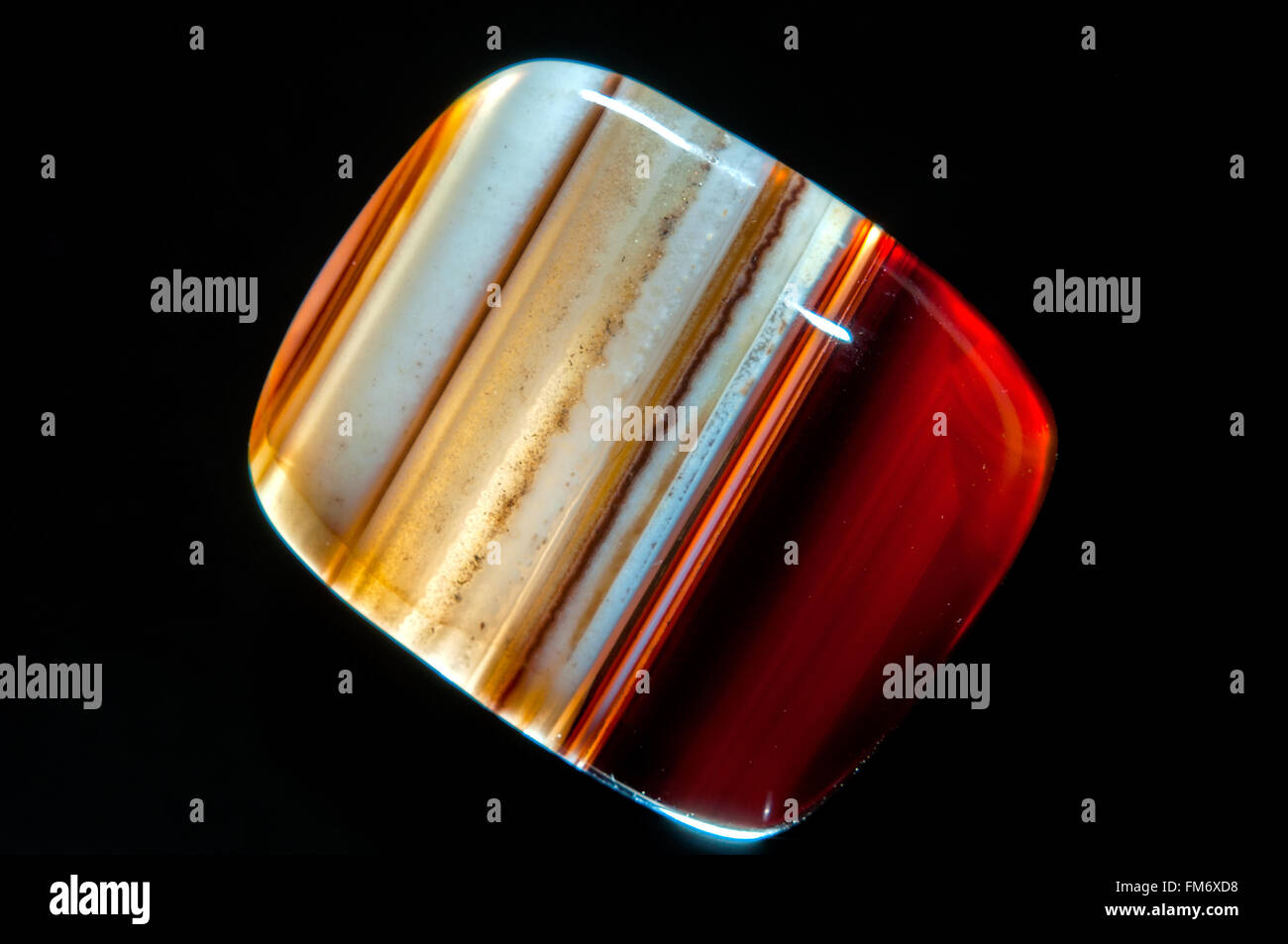 Natural banded agate mineral stone in studio setting Stock Photo - Alamy