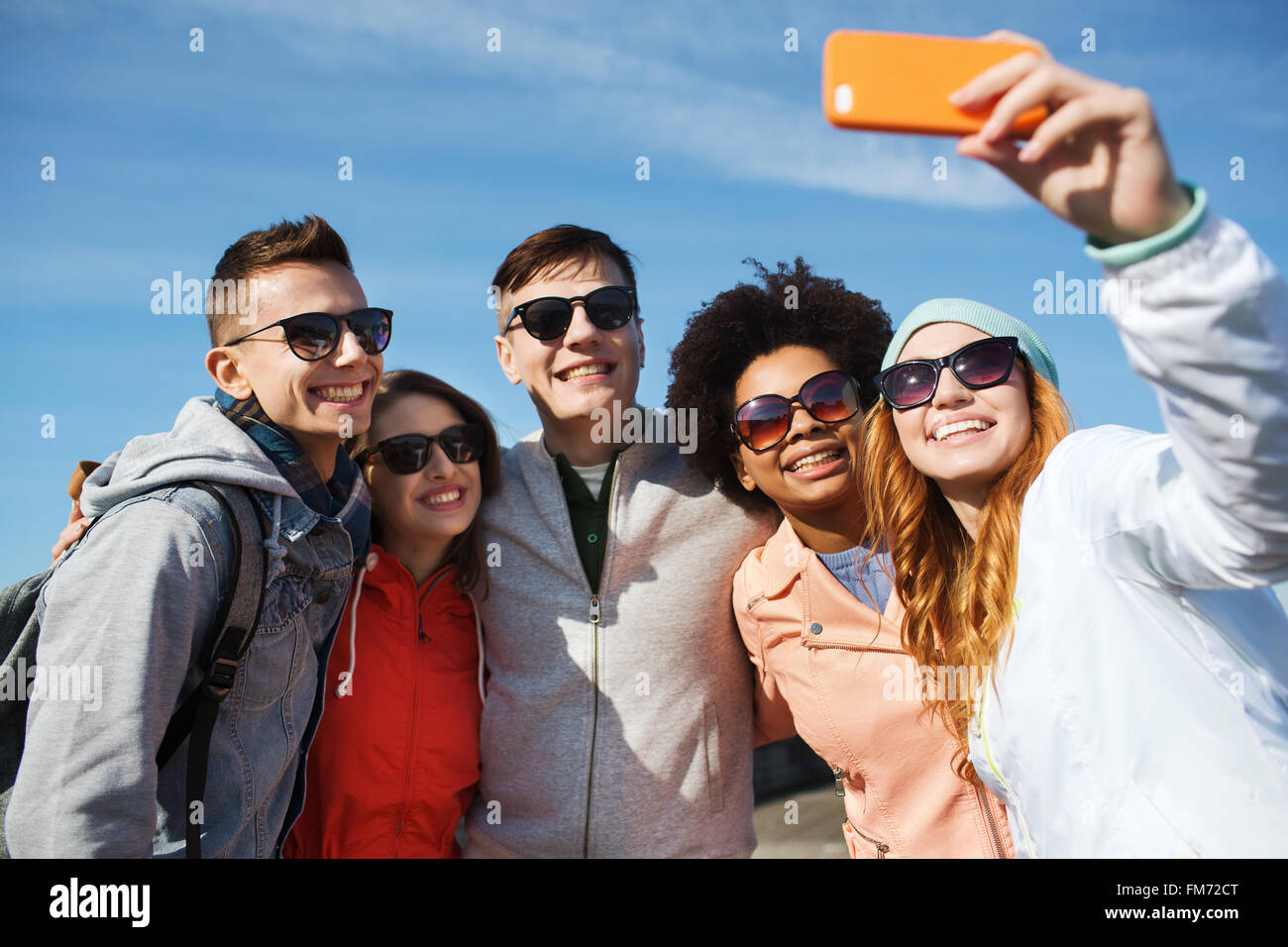 smiling friends taking selfie with smartphone Stock Photo - Alamy
