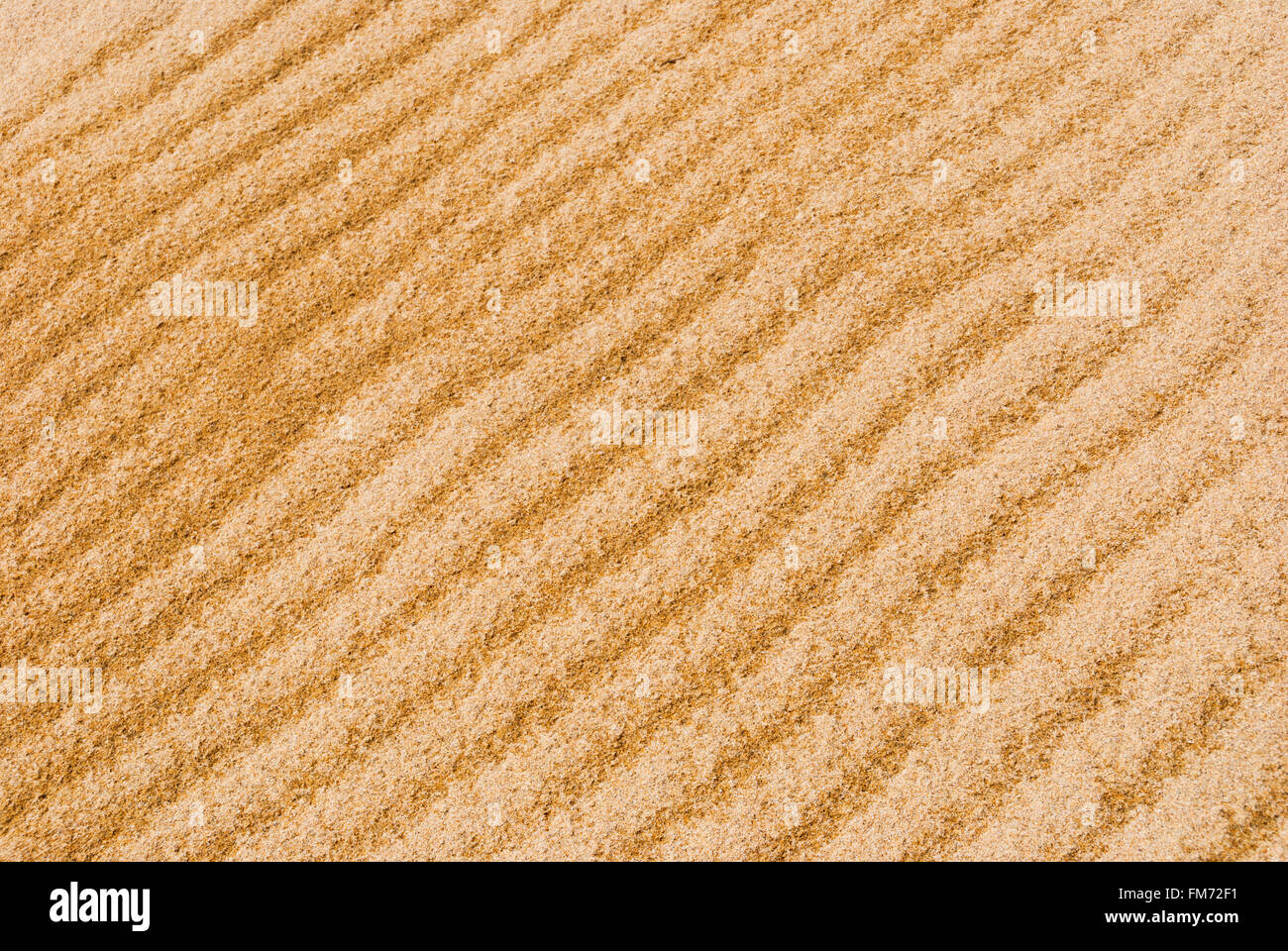 Sandy beach background diagonal Stock Photo - Alamy