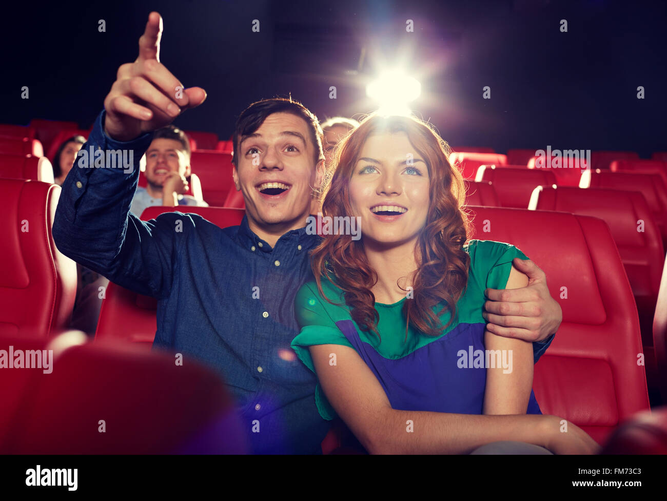 happy friends watching movie in theater Stock Photo - Alamy