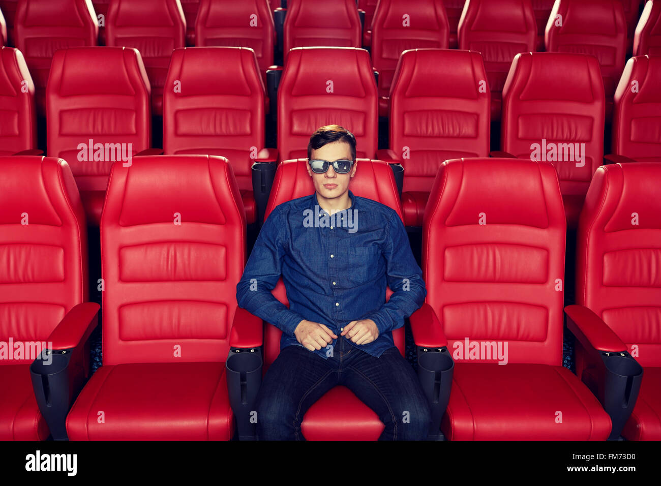 young man watching movie in 3d theater Stock Photo - Alamy