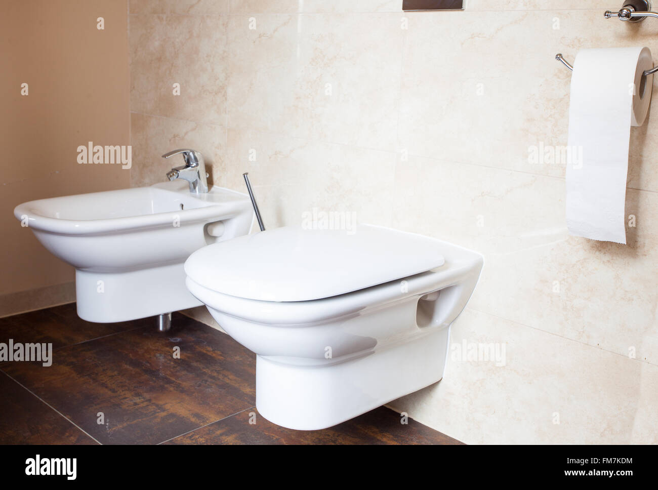 Hygiene and physiological needs. Closeup of white porcelain bidet and ...