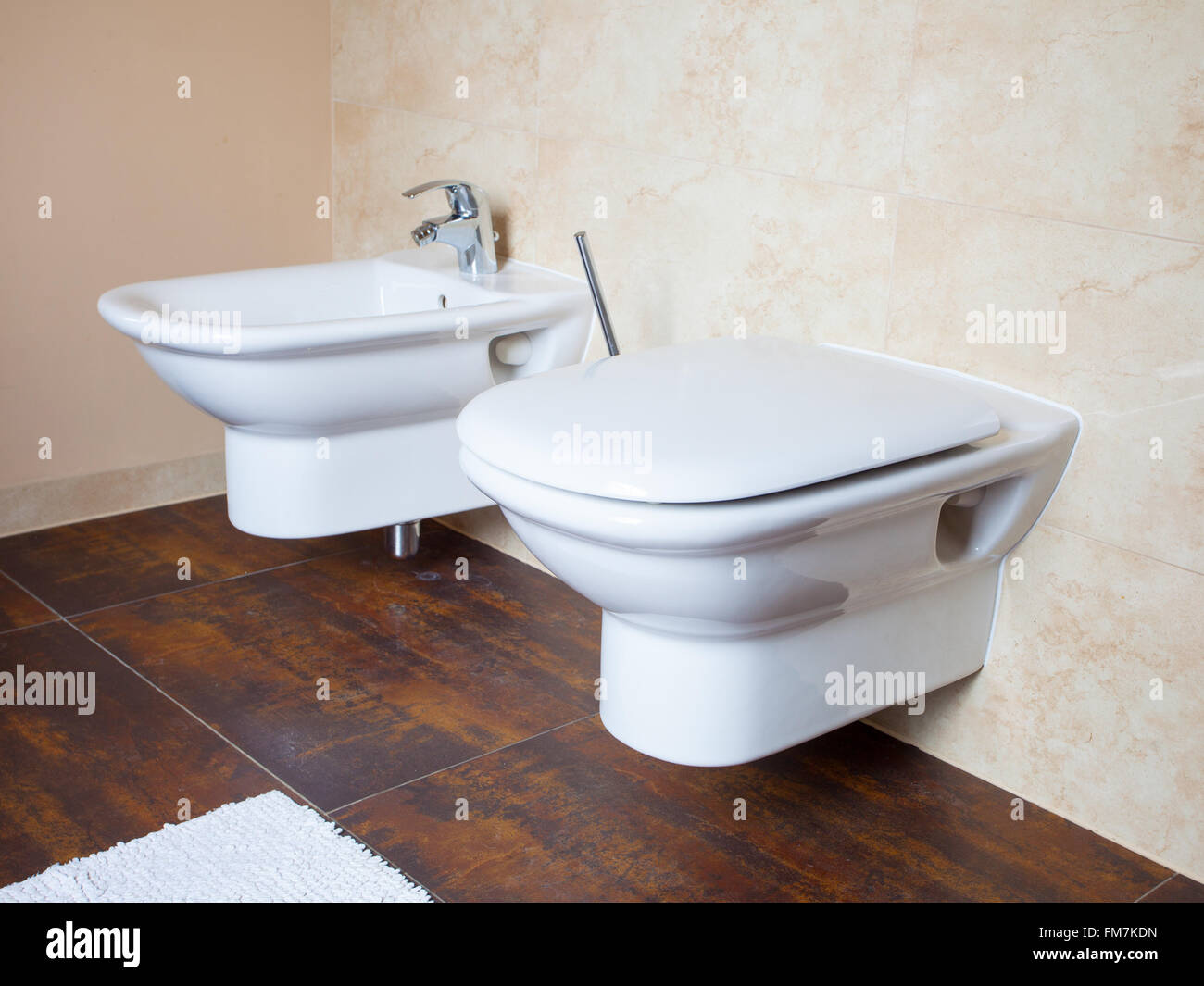 Hygiene and physiological needs. Closeup of white porcelain bidet and ...