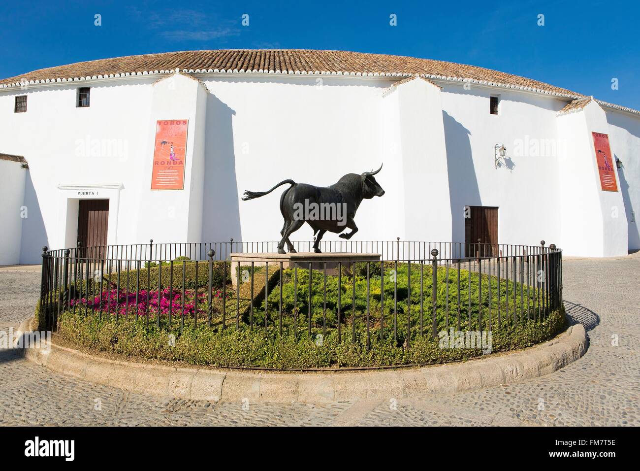 Spain, Andalucia, Malaga Province, Ronda, bull sculpture in front of ...