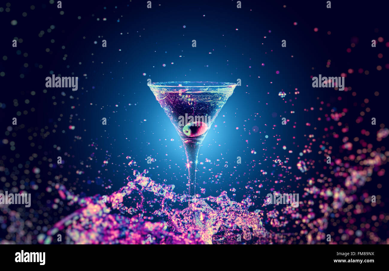 Colourful cocktail in glass with splash Stock Photo - Alamy