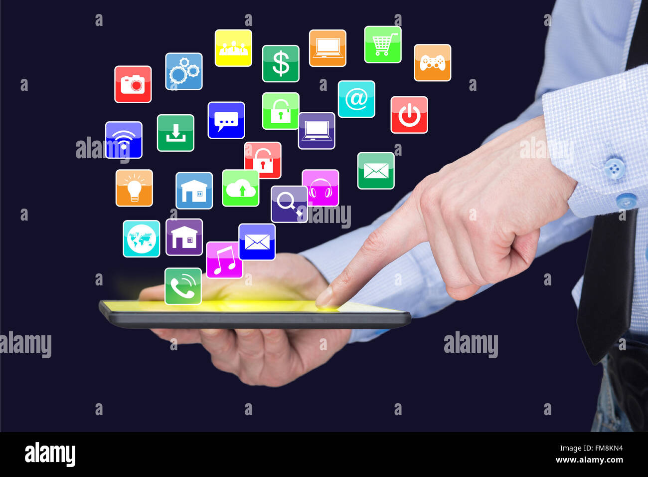 Businessman holding a tablet pc with mobile applications icons on ...