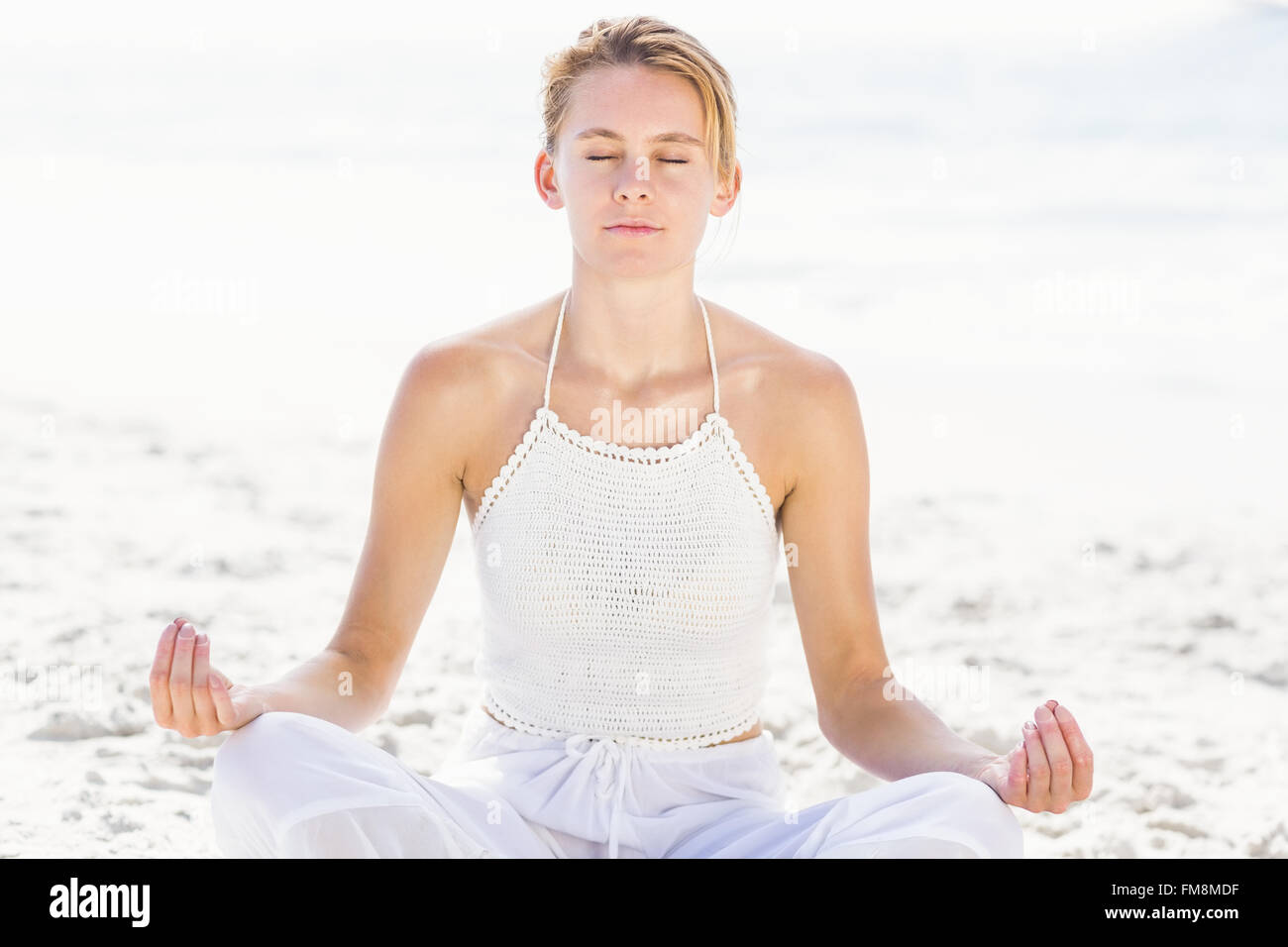 Beautiful woman in lotus position Stock Photo - Alamy
