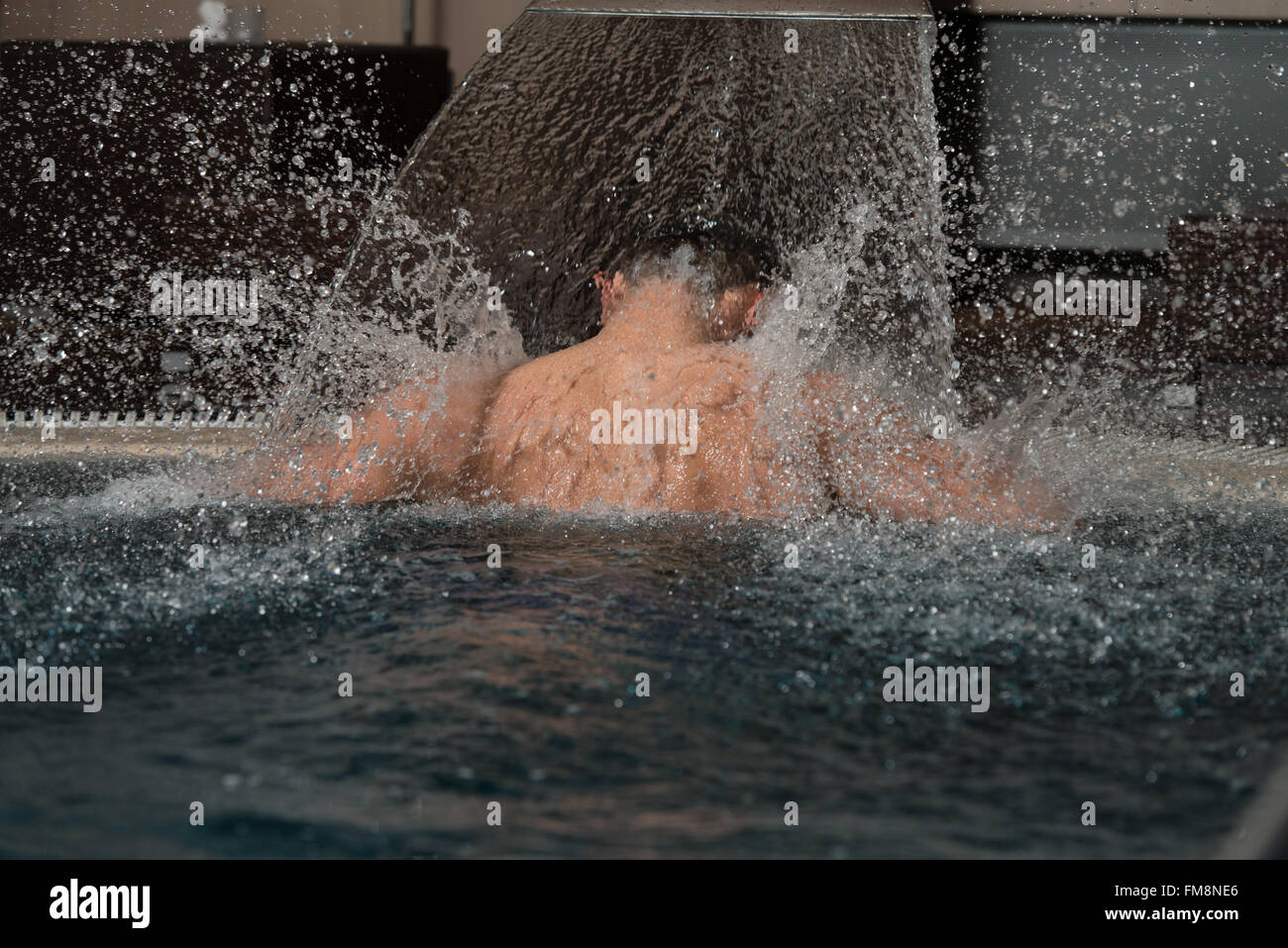 Happy Attractive Man Resting Relaxed On Edge Of Swimming Pool Stock ...