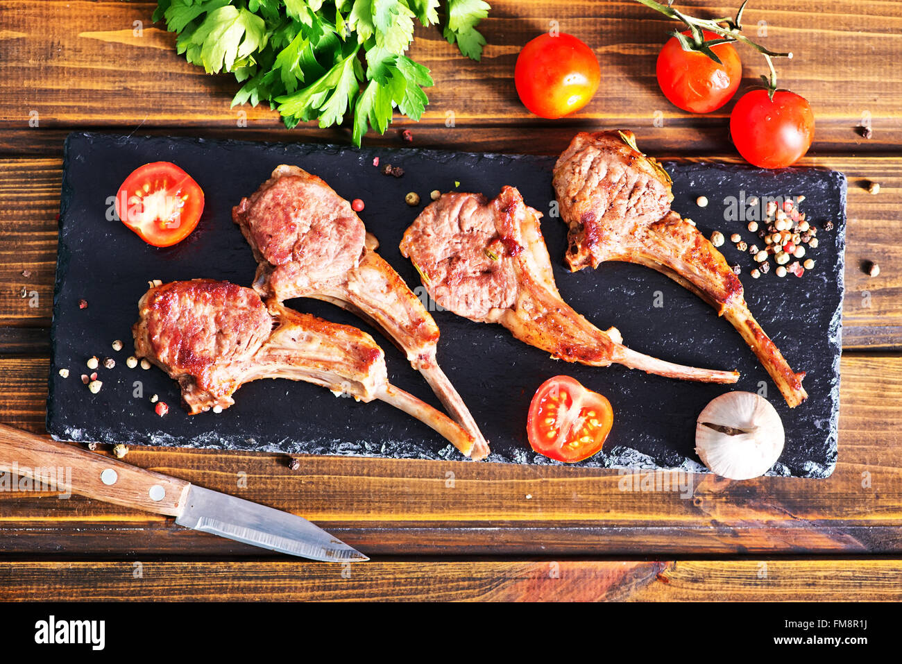 Rack of lamb fried with aromatic olive oil, herbs and spices Stock ...