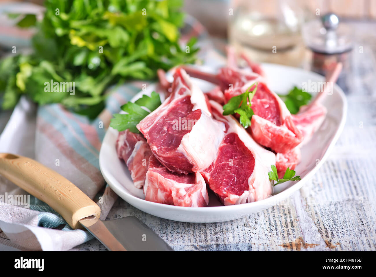 raw meat with spice and herb on a table Stock Photo - Alamy