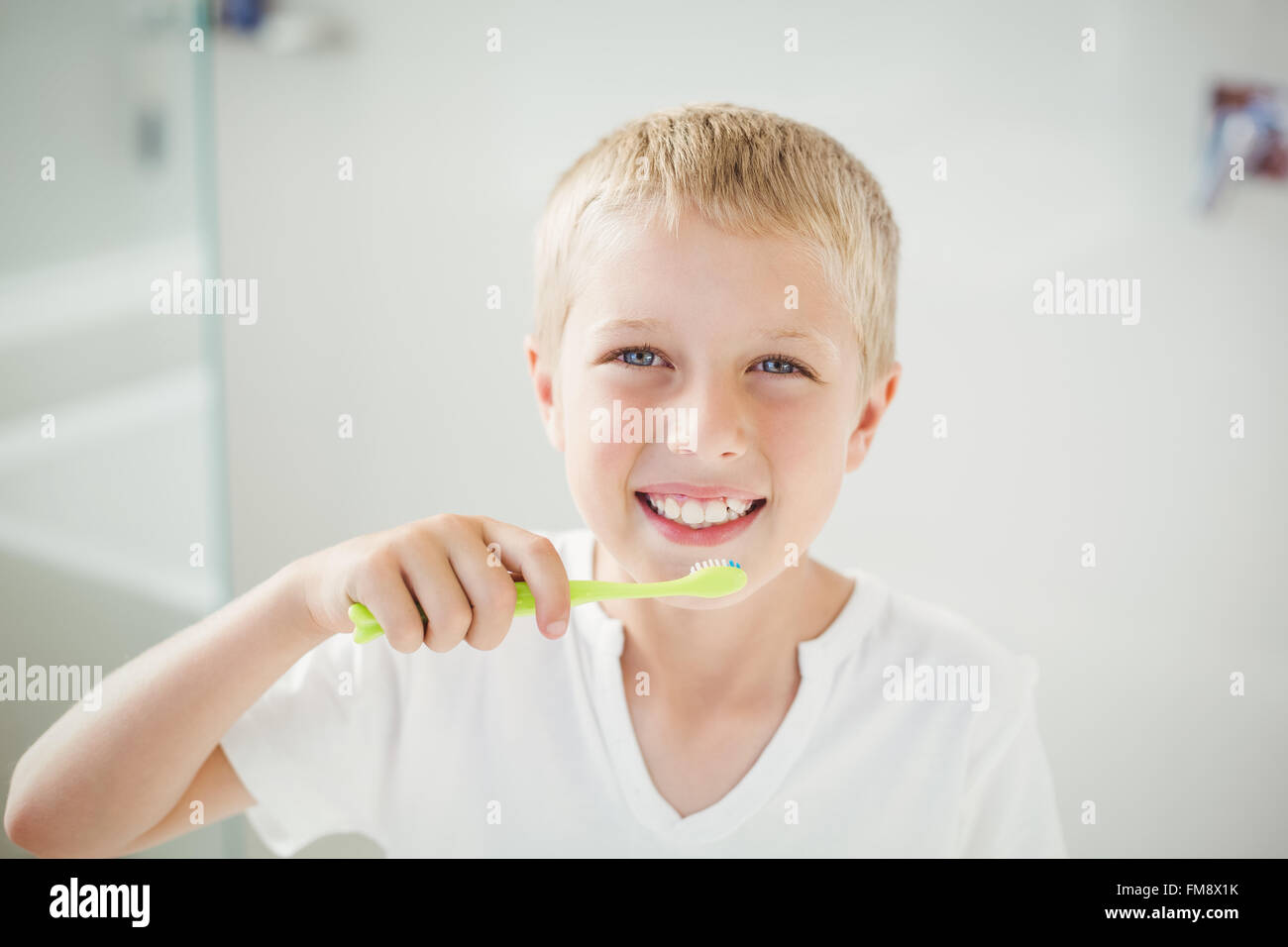 Portrait of boy brushing teeth Stock Photo - Alamy