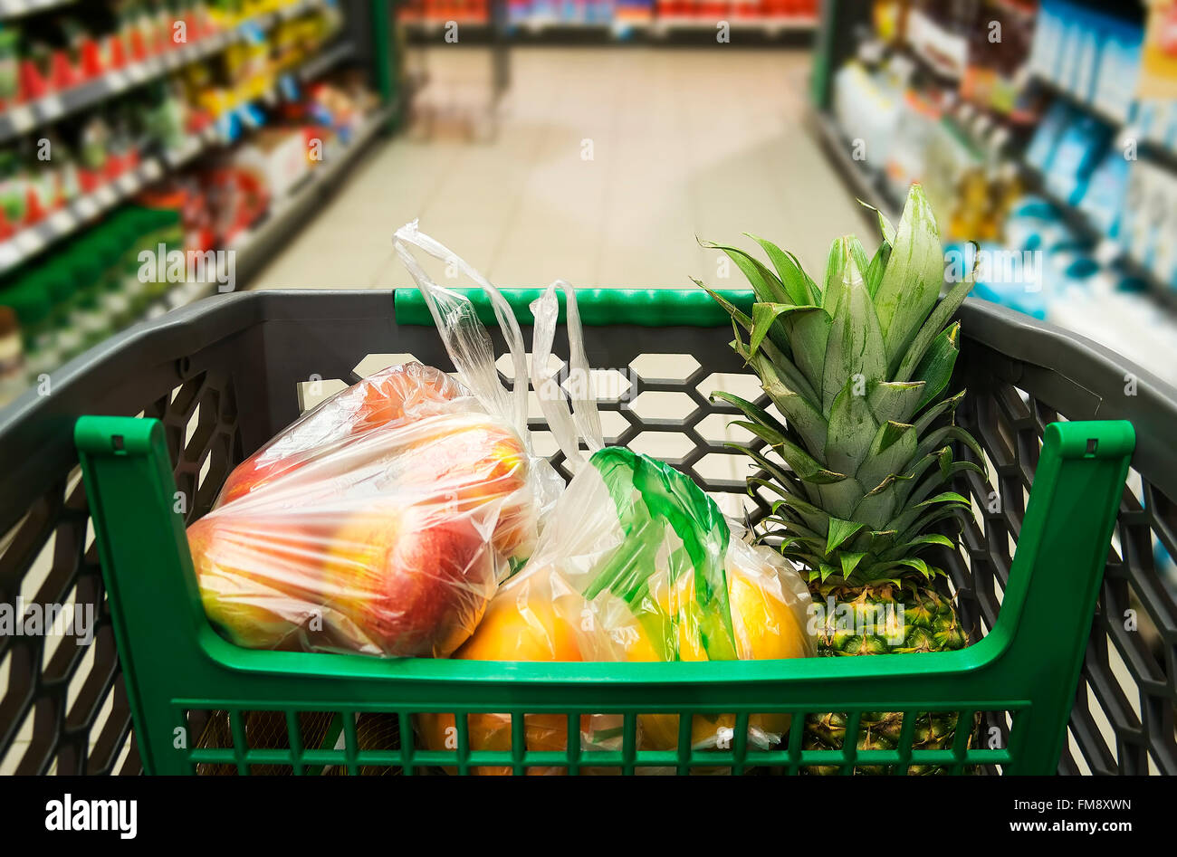 Shopping cart filled with some fruit Stock Photo - Alamy