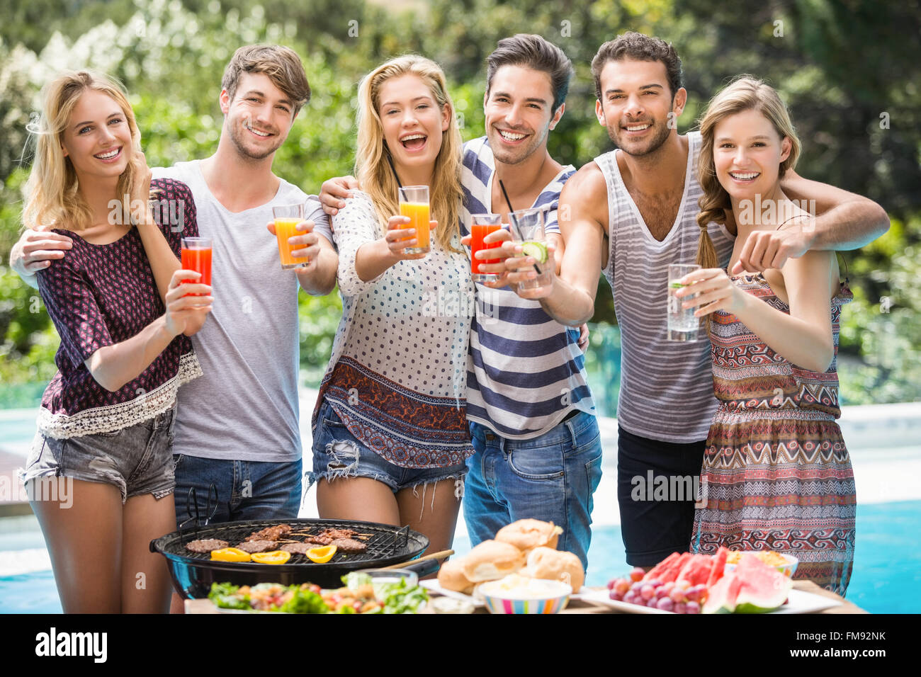Portrait of friends having juice at outdoors barbecue party Stock Photo ...