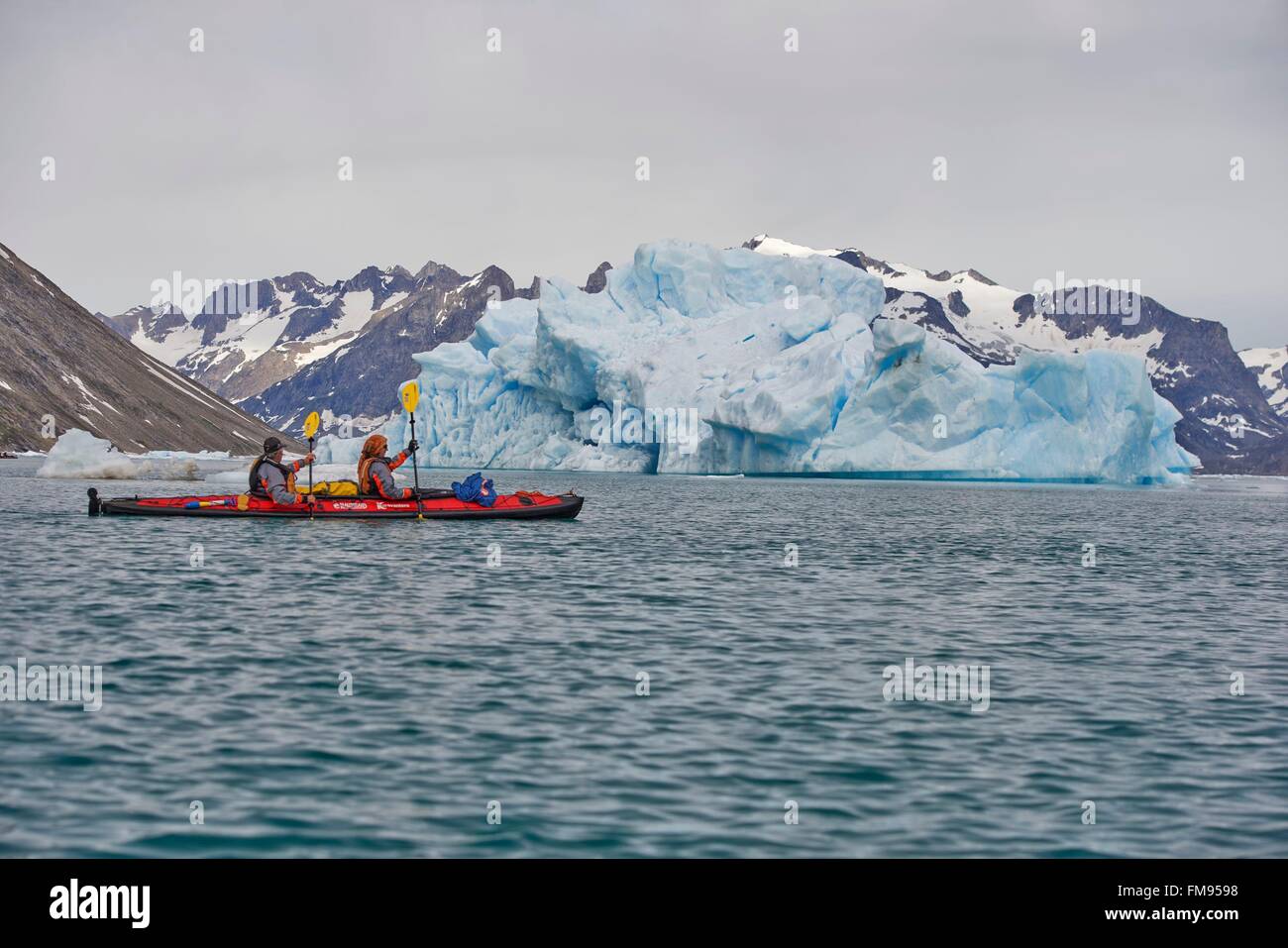 Greenland, Sermersooq, Kulusuk, Inuit village of Kulusuk, sea kayaks in ...