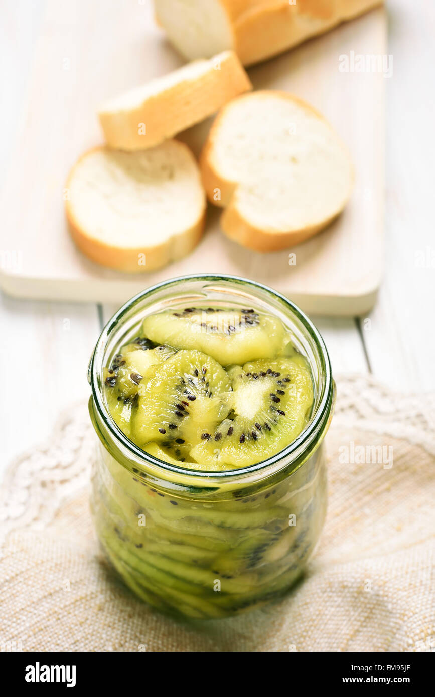 Preserved kiwi in jar and sliced bread Stock Photo - Alamy
