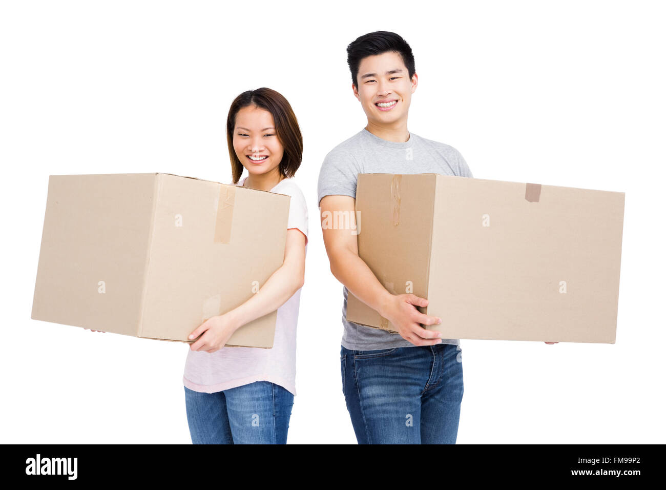 Young couple holding cardboard boxes Stock Photo - Alamy
