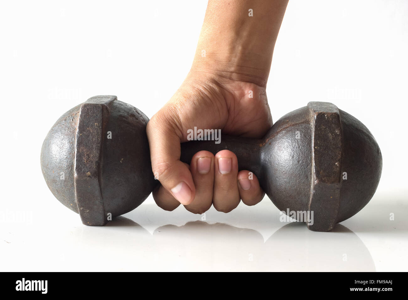Hand holding dumbell on isolated white background Stock Photo - Alamy