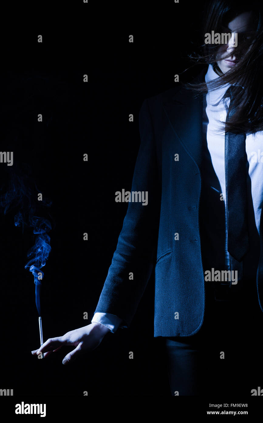 Brunette smoking cigarette hi-res stock photography and images - Alamy