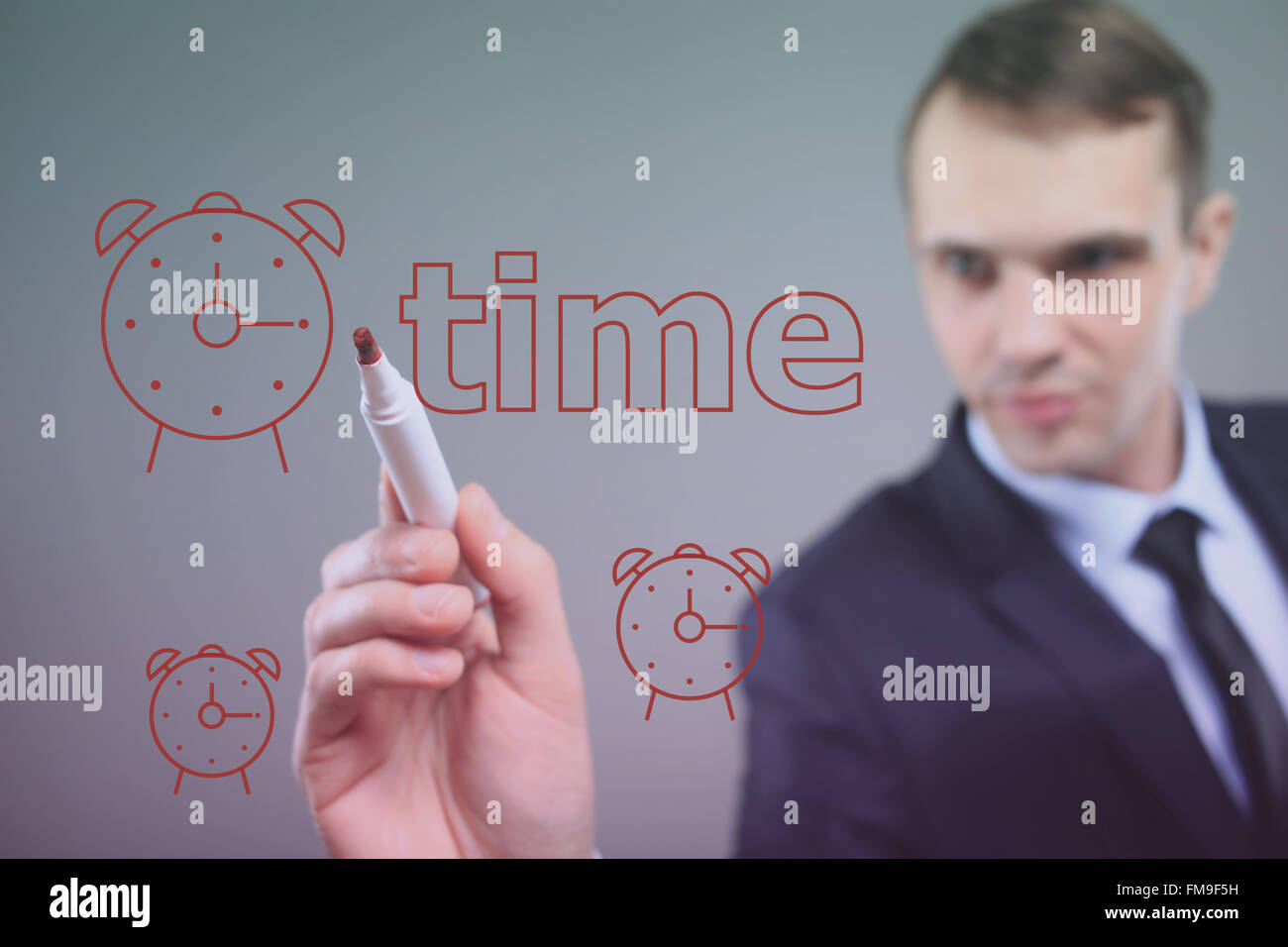 businessman writing on a transparent board - time. painted clock Stock ...