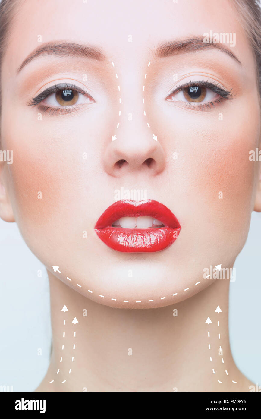 Portrait of young, beautiful and healthy woman with arrows on her face ...