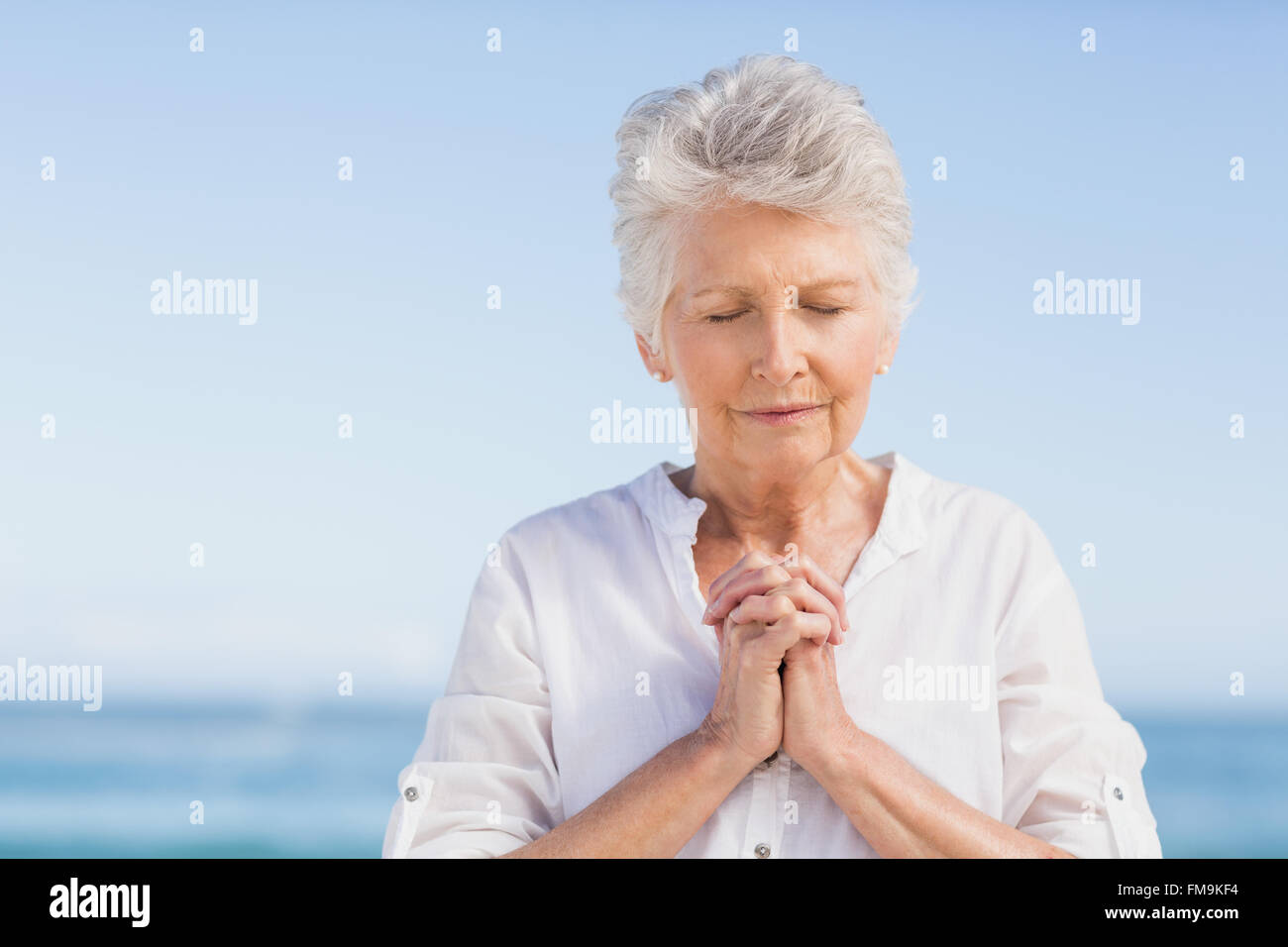 Woman Praying Beach High Resolution Stock Photography and Images - Alamy