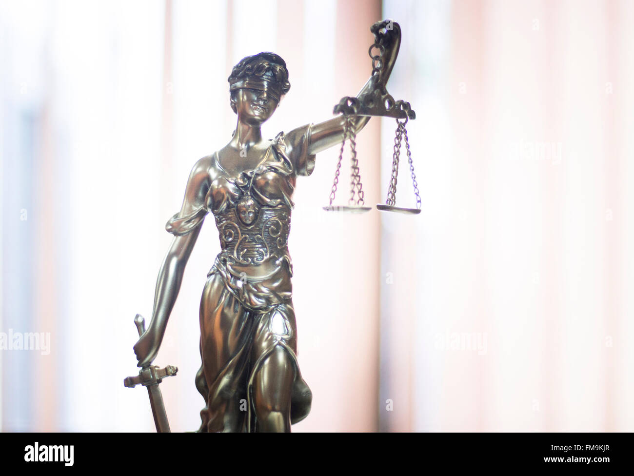 Legal blind justice metal statue with scales in chain in law firm ...
