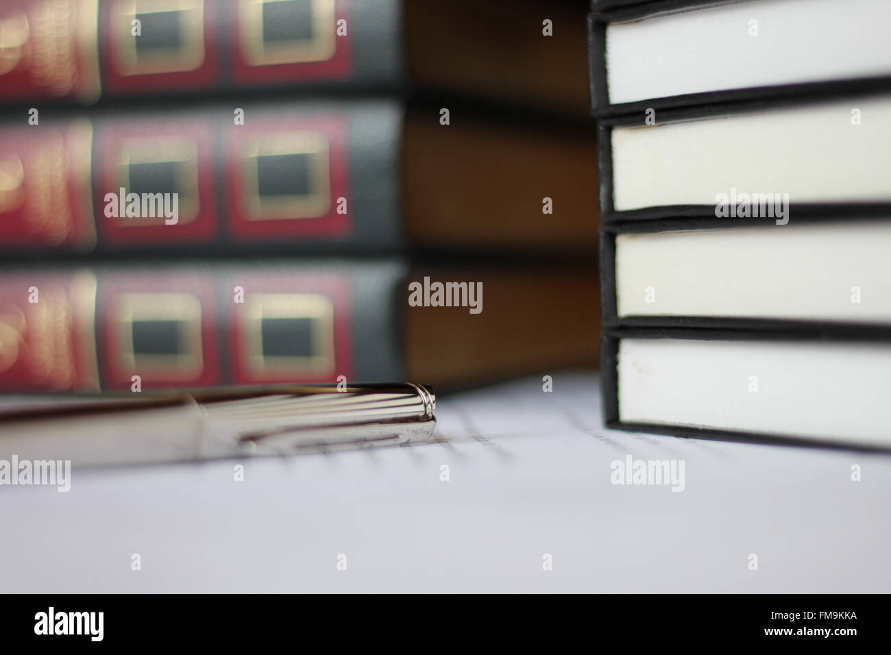 Studying on a table Stock Photo - Alamy