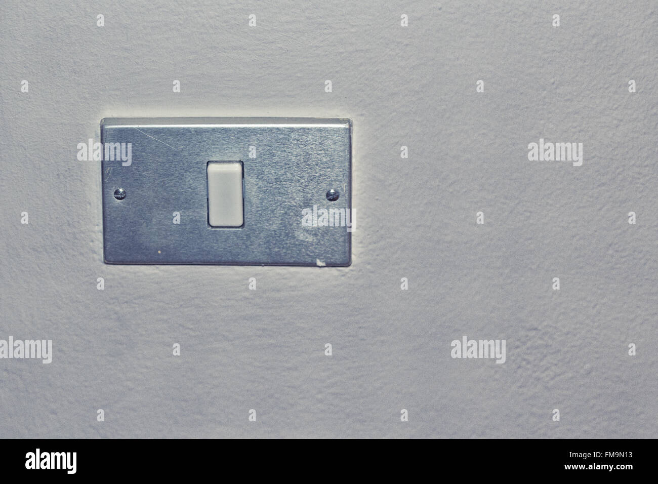 old vintage light switch plate Stock Photo - Alamy