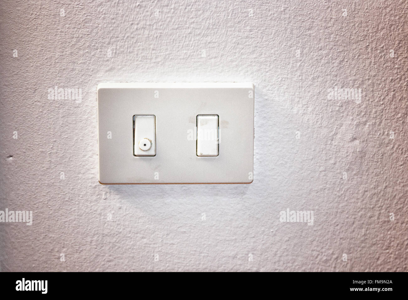 old vintage light switch plate Stock Photo - Alamy
