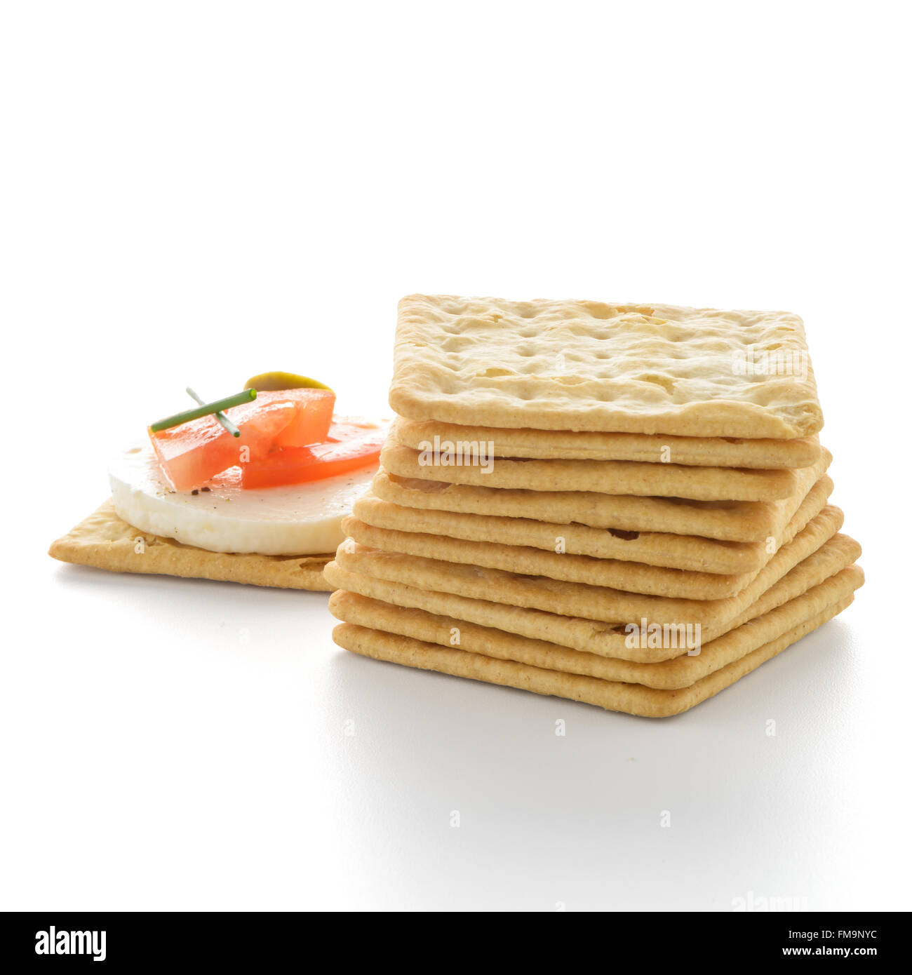 Crackers with cheese and tomato isolated on white background Stock ...