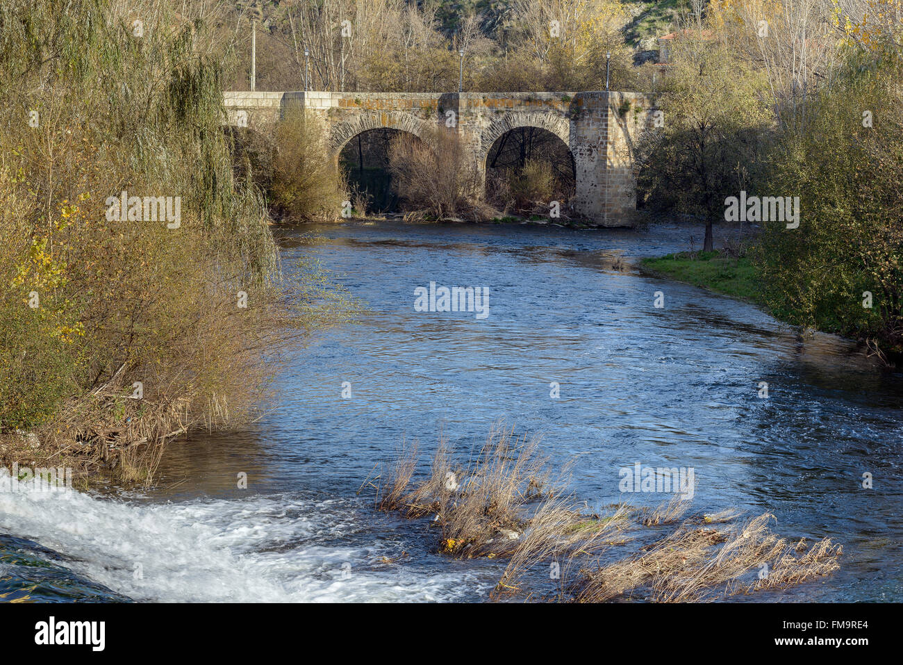 San Lazaro roman bridge that crosses the river Jerte in Plasencia ...