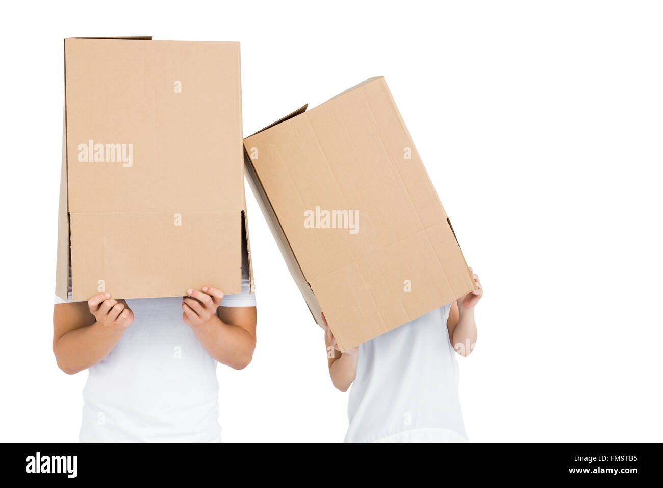 Young couple with cardboard boxes on their heads Stock Photo - Alamy