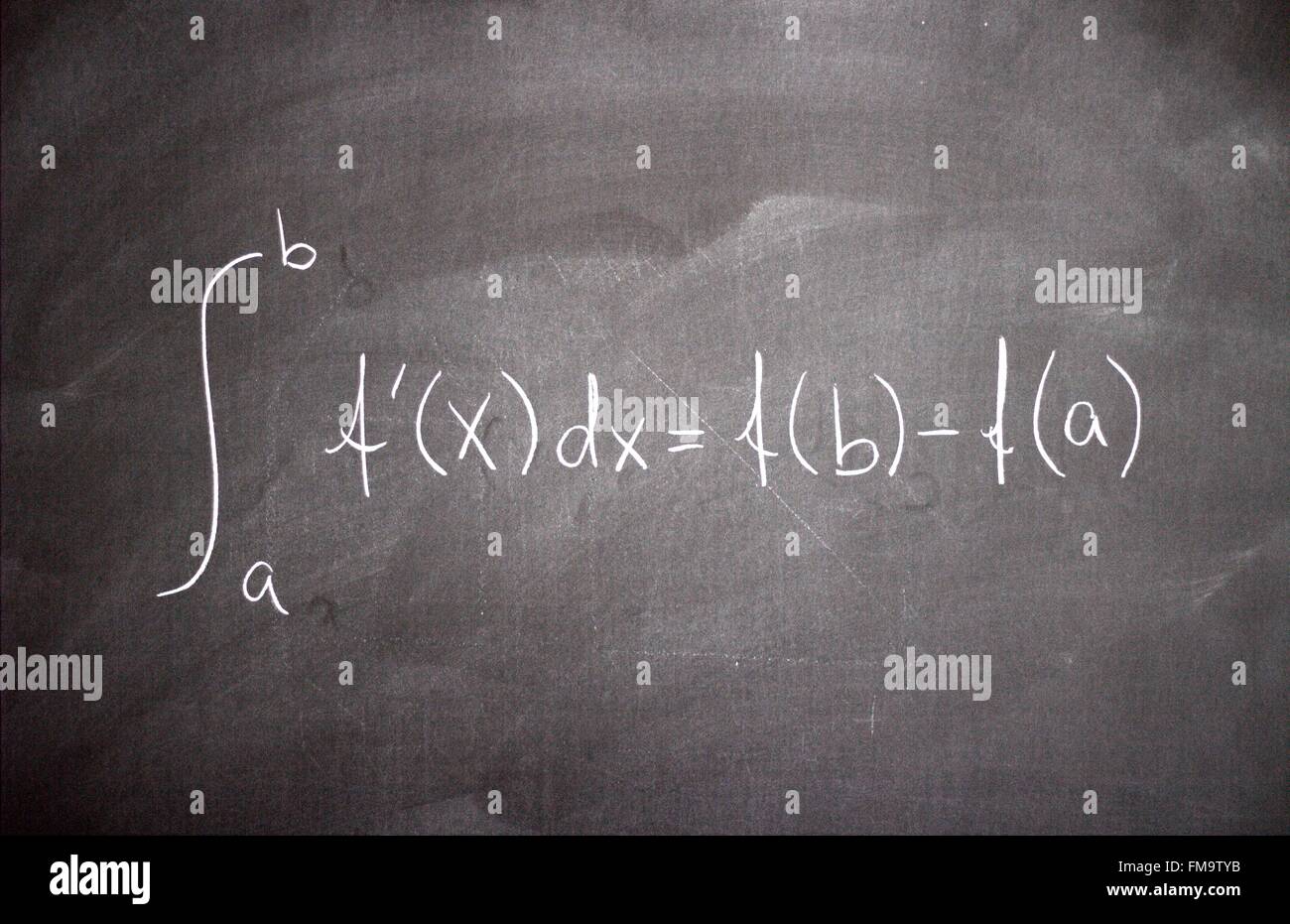 Studying the science of mathematics and economics on a blackboard Stock ...