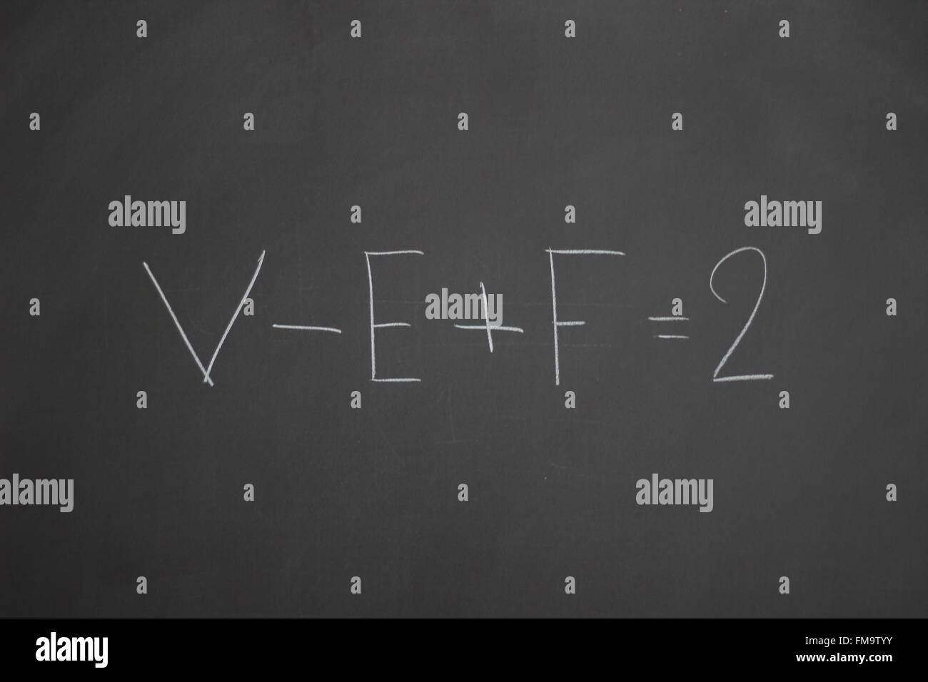 Studying the science of mathematics and economics on a blackboard Stock ...