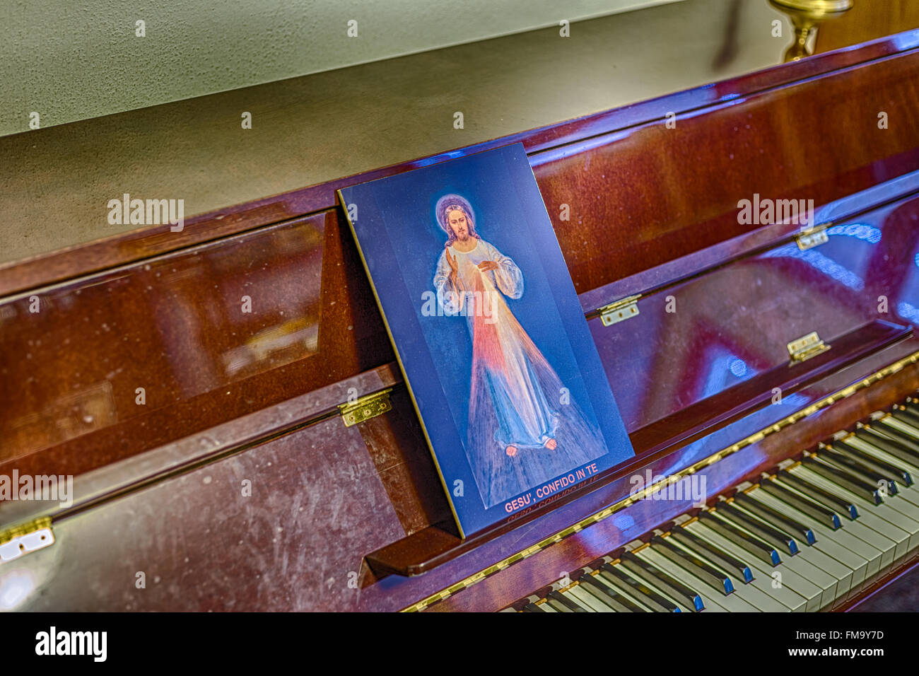 the icon of the first Merciful Jesus image on a piano in place of ...