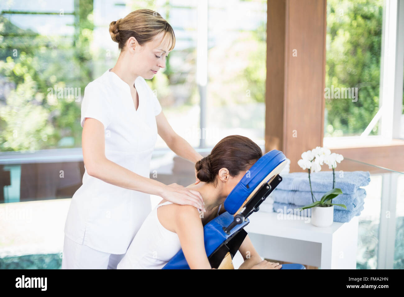 Young woman receiving shoulder massage Stock Photo - Alamy
