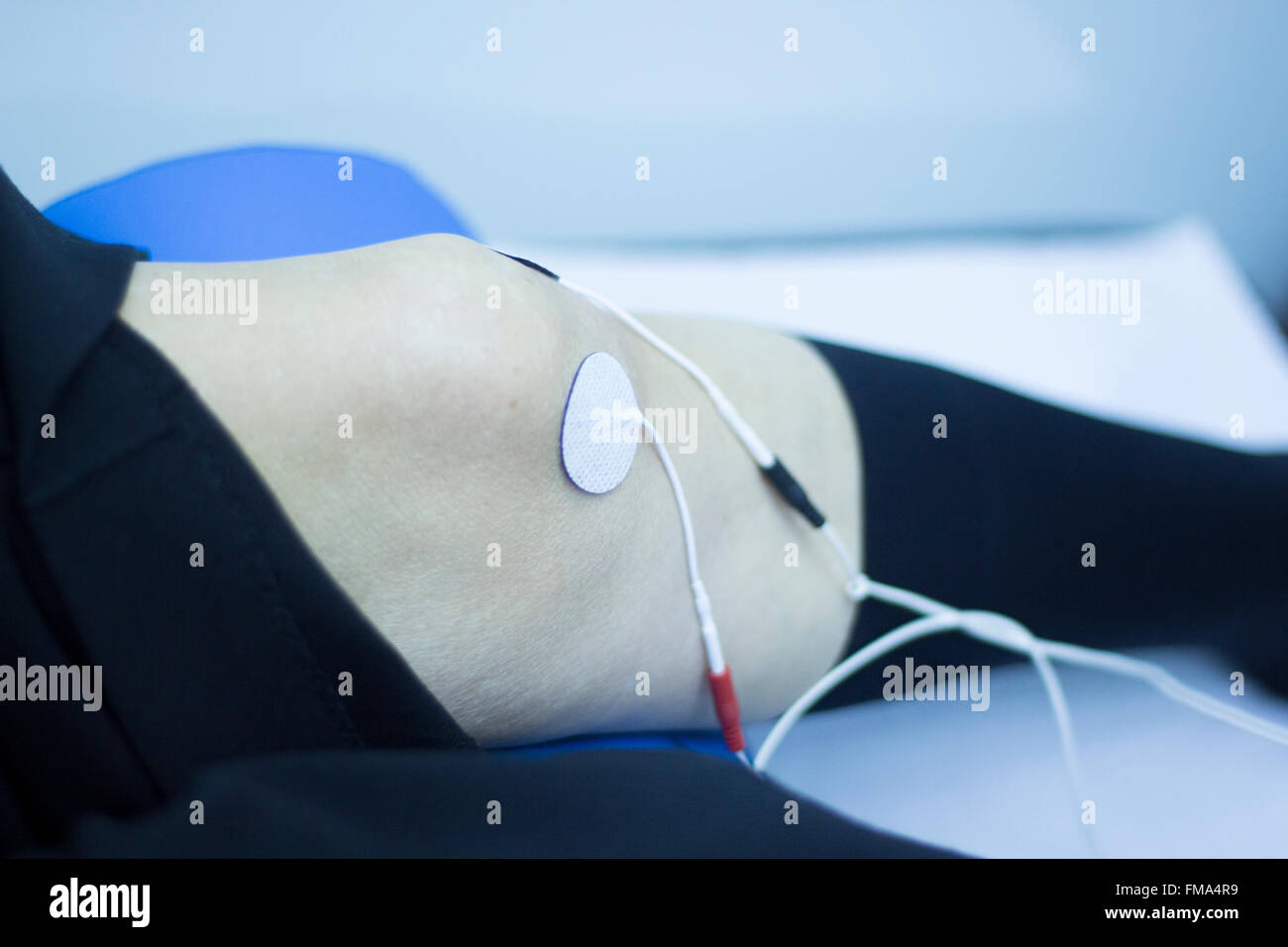 Physical therapy clinic of hospital. Patient having electrical impulse ...